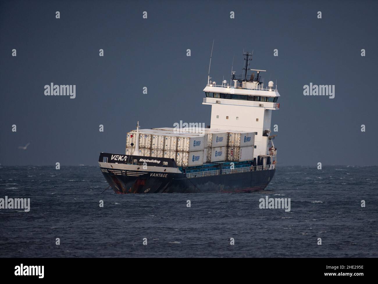 Vantage. Cargo boat at anchor Stock Photo - Alamy