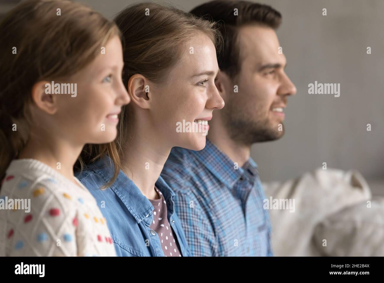 Side view two generations family looking in distance Stock Photo - Alamy