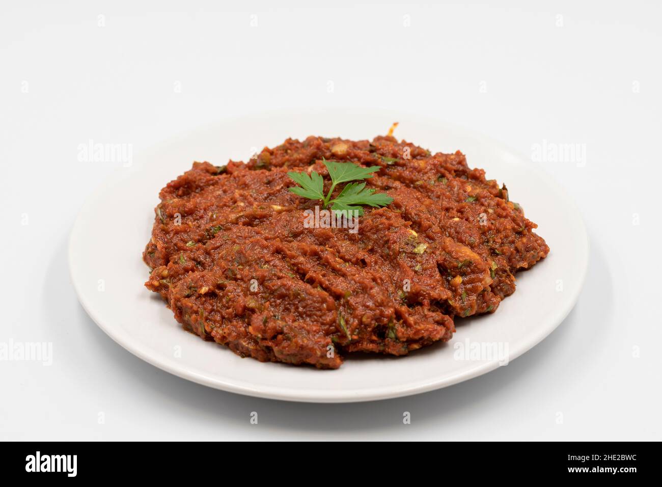 Chili paste on a white background. spicy paste. A kind of adjika ...