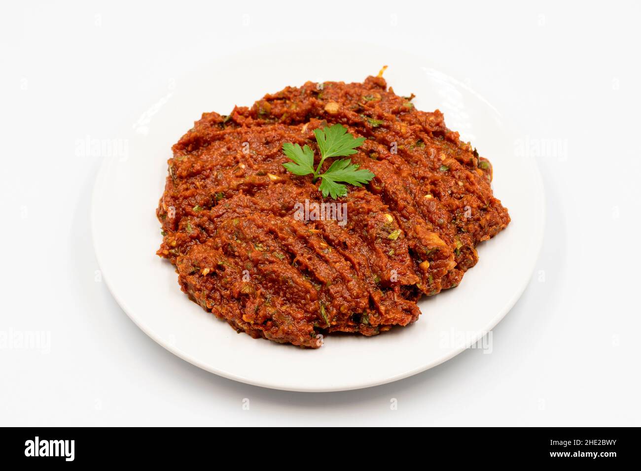 Chili paste on a white background. spicy paste. A kind of adjika ...