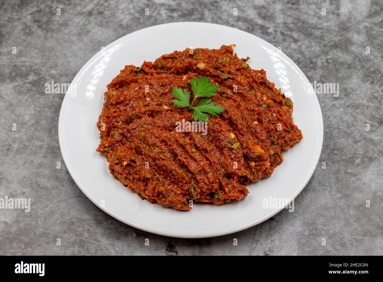 Chili paste on a dark background. spicy paste. A kind of adjika ...