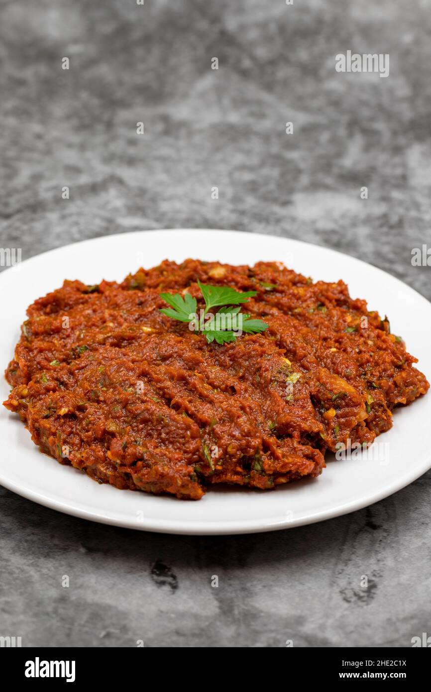 Chili paste on a dark background. spicy paste. A kind of adjika ...