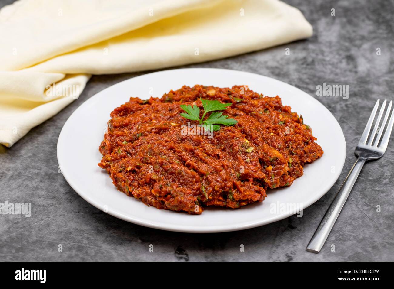 Chili paste on a dark background. spicy paste. A kind of adjika ...