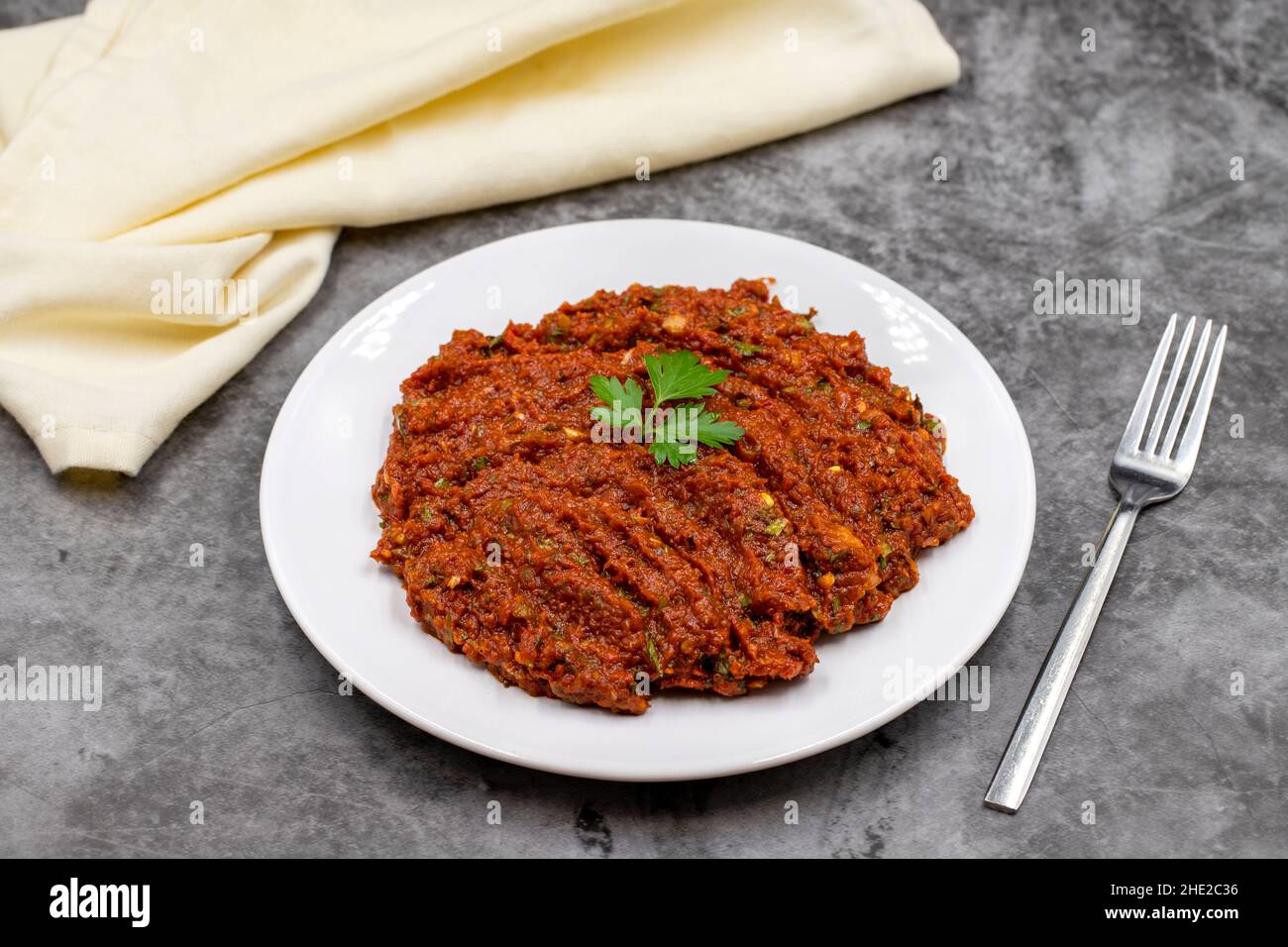 Chili paste on a dark background. spicy paste. A kind of adjika ...