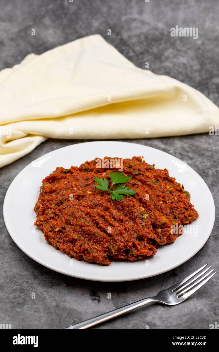 Chili paste on a dark background. spicy paste. A kind of adjika ...