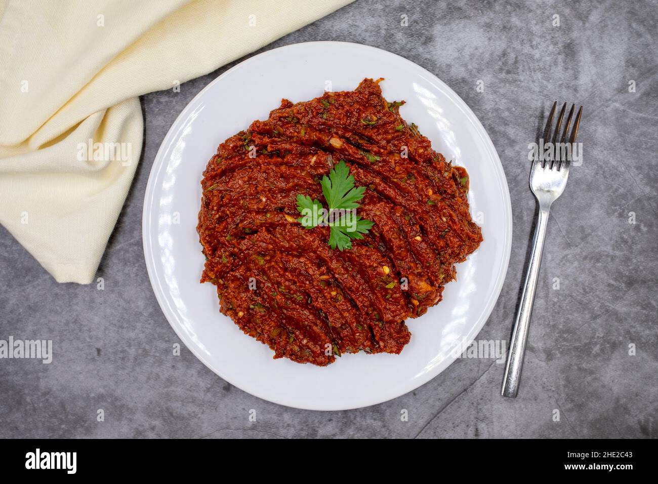 Chili paste on a dark background. spicy paste. A kind of adjika ...