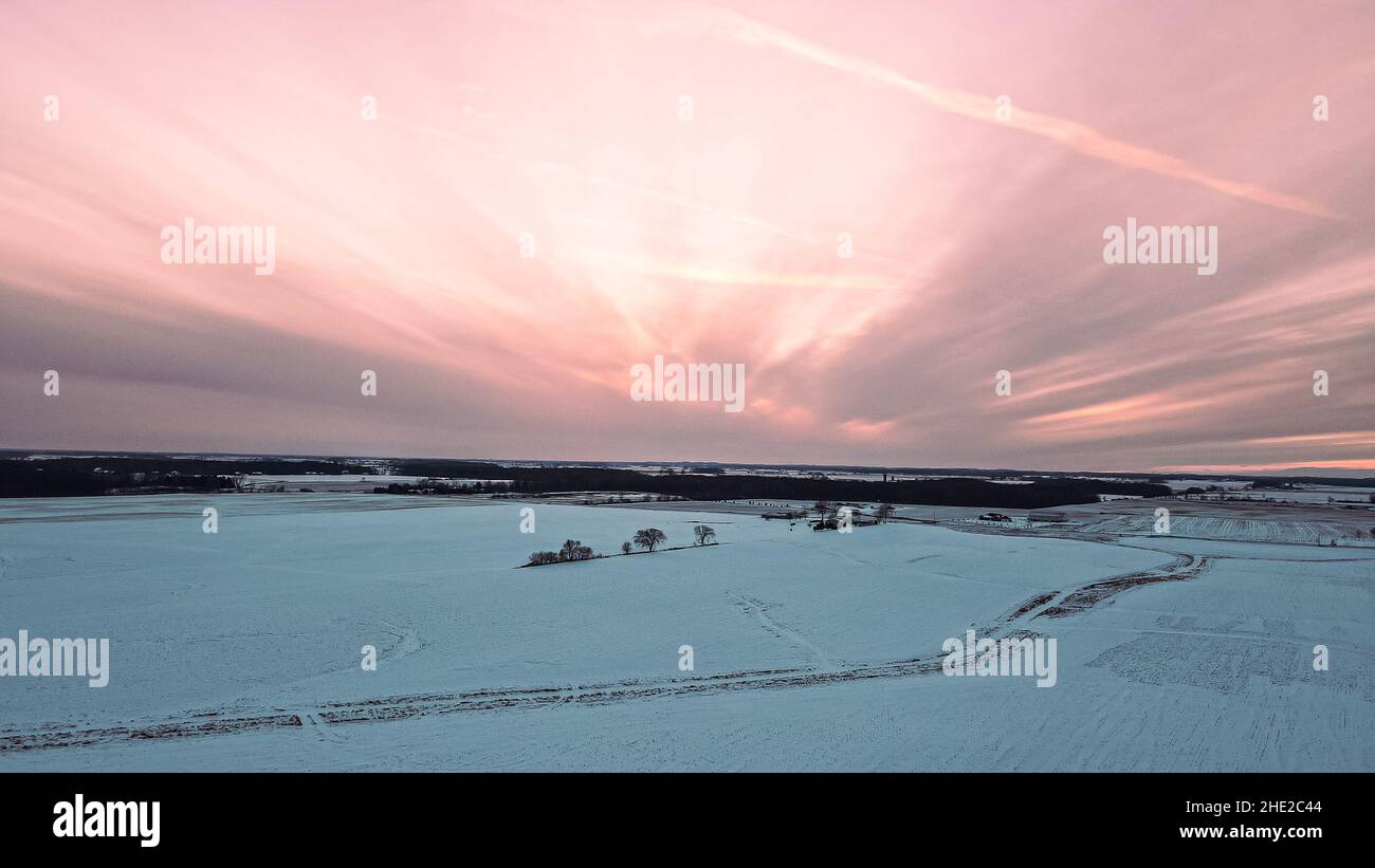 Winter landscape with clouds streaking the sky Stock Photo - Alamy