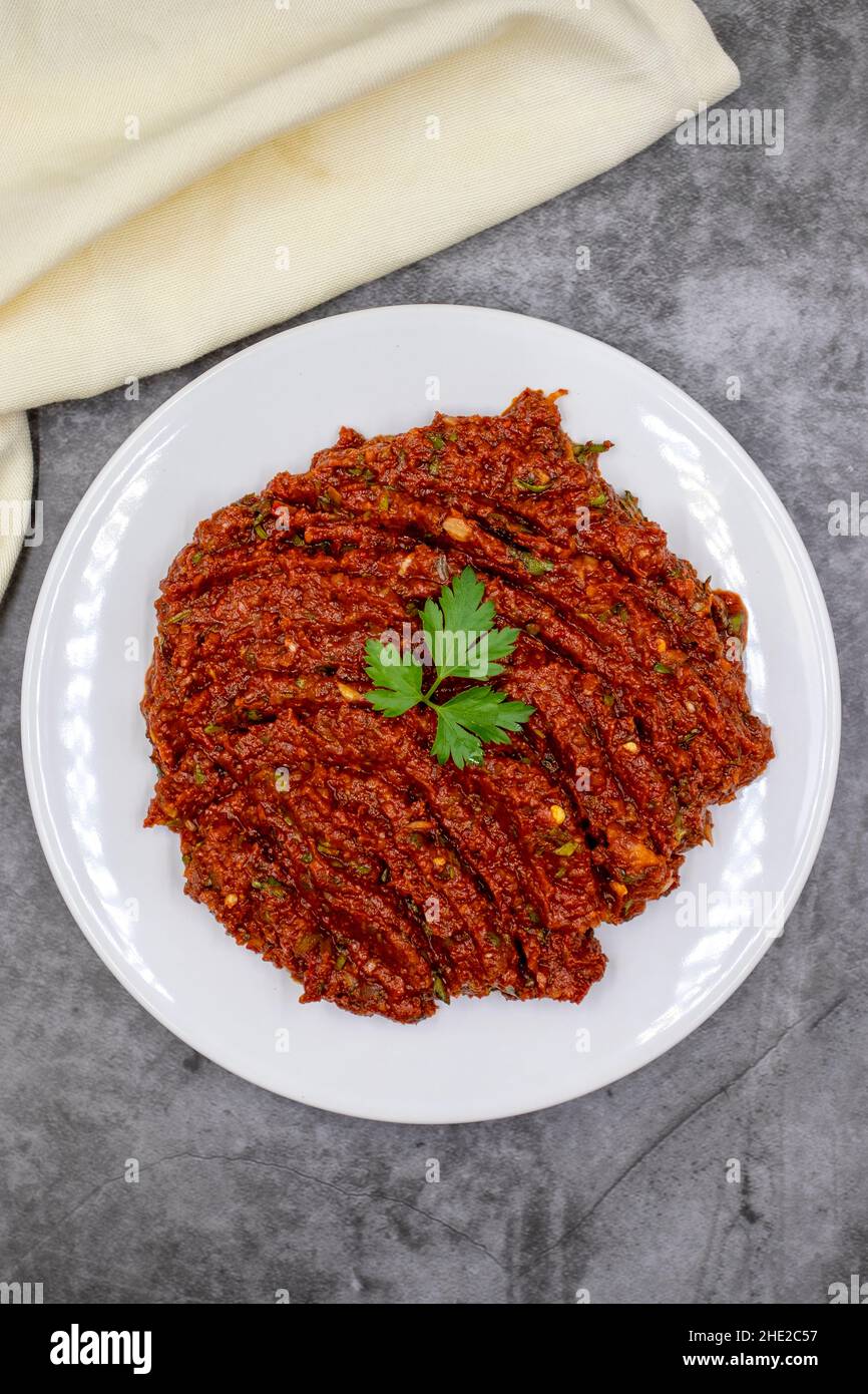 Chili paste on a dark background. spicy paste. A kind of adjika ...