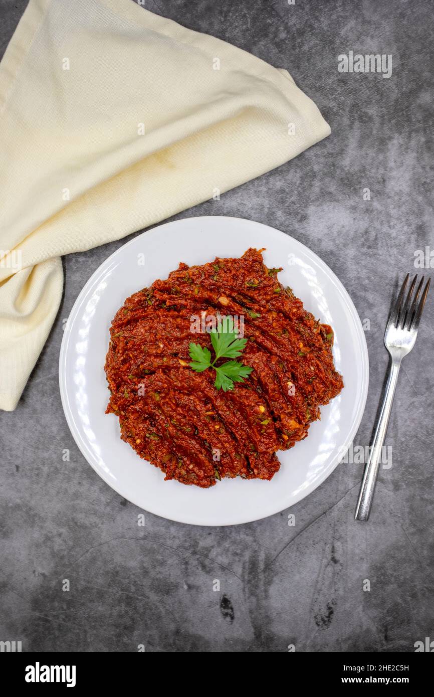 Chili paste on a dark background. spicy paste. A kind of adjika ...