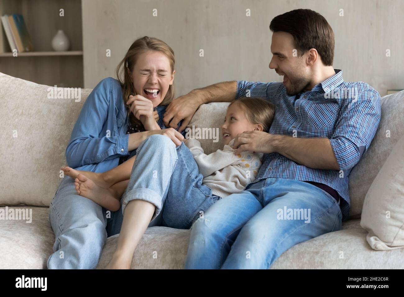 Happy family having fun together at home Stock Photo - Alamy