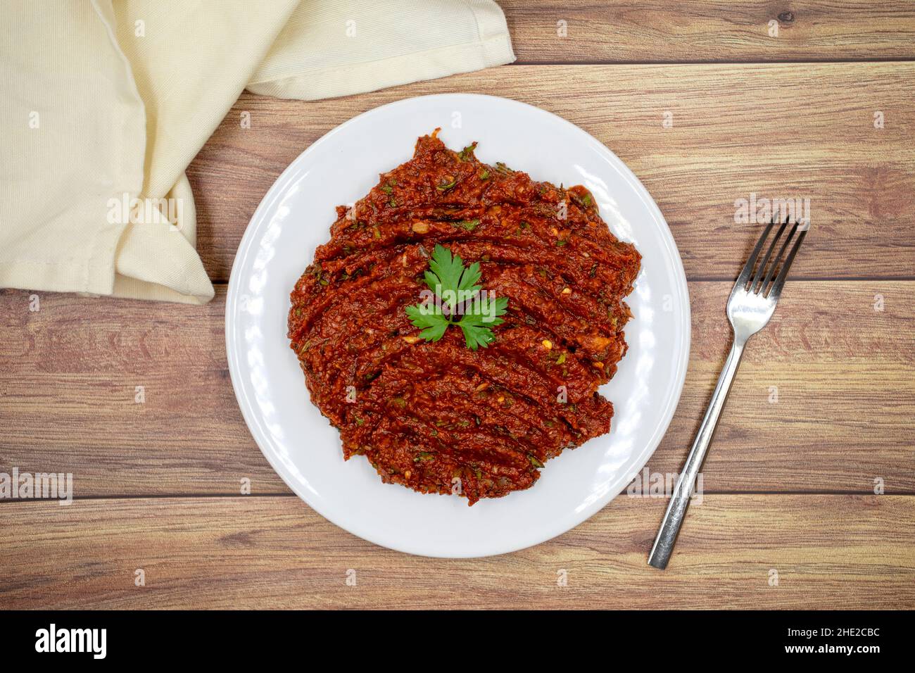 Chili paste on a wooden background. spicy paste. A kind of adjika ...
