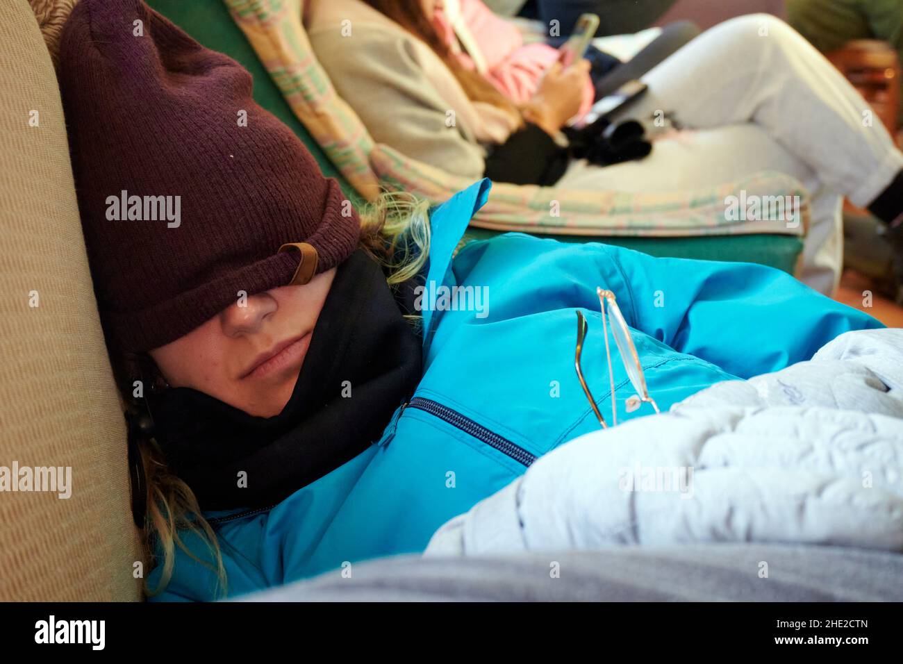 Female hiker sleeping and resting with a hat in the middle of hiking ...