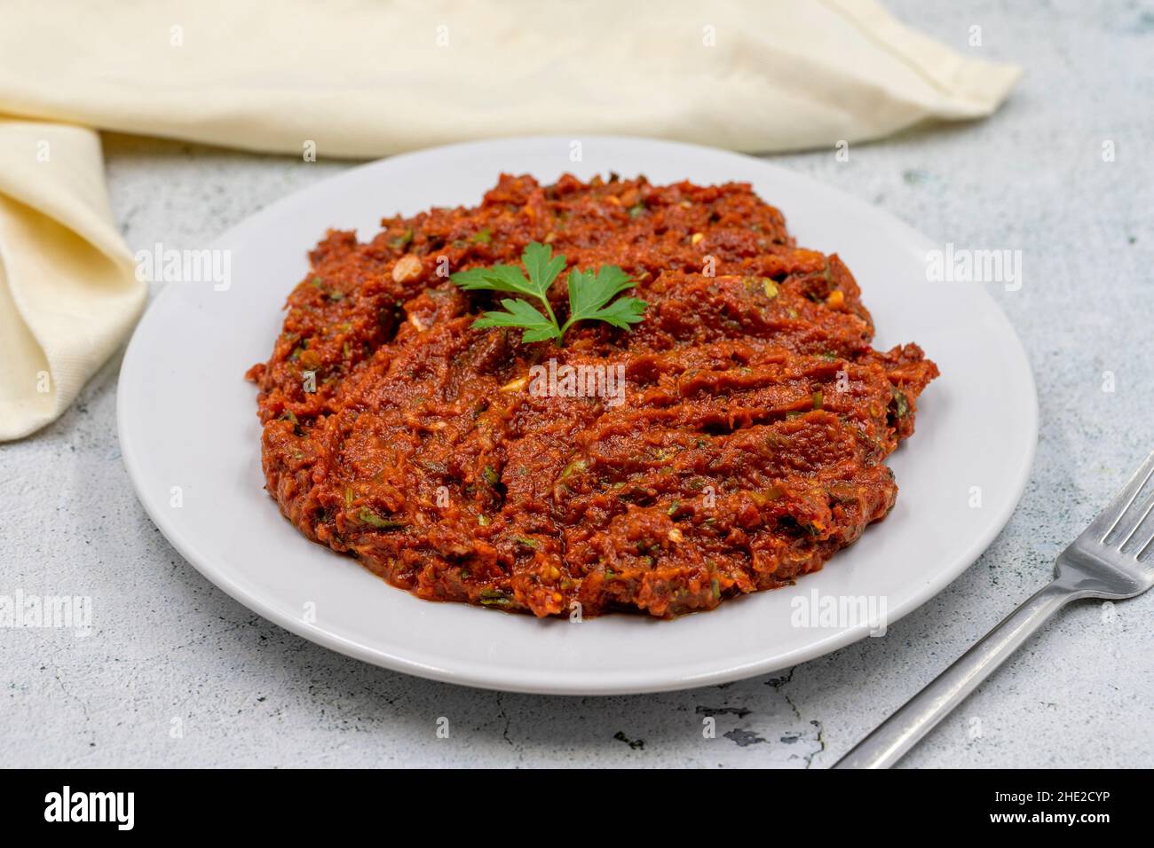 Chili paste on a stone background. spicy paste. A kind of adjika ...