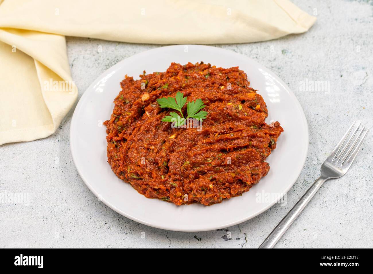 Chili paste on a stone background. spicy paste. A kind of adjika ...