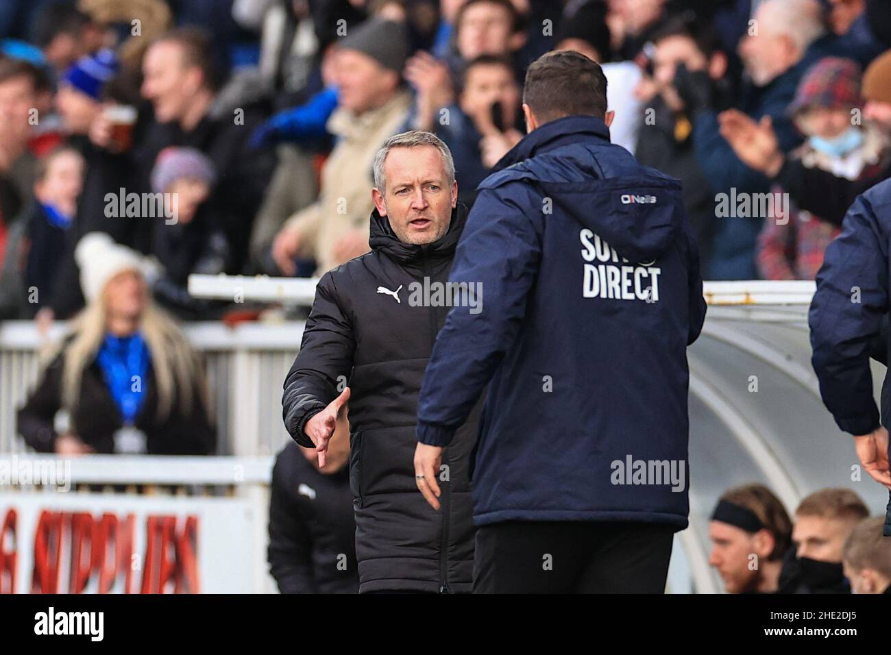 Neil Critchley head Coach of Blackpool shakes hands with Graeme Lee ...
