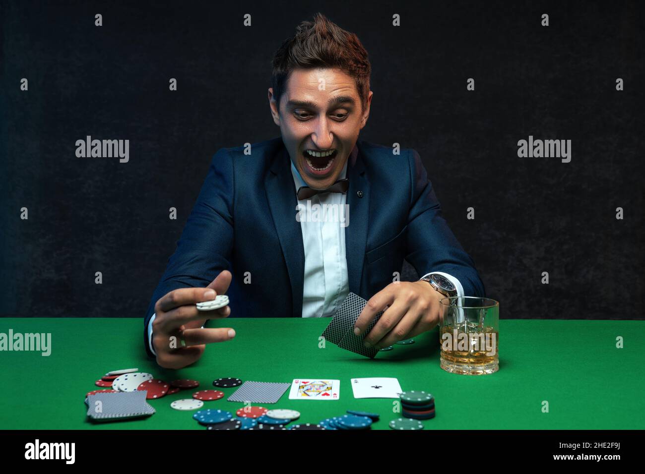 The lucky poker player rejoices at his victory and cannot contain his ...