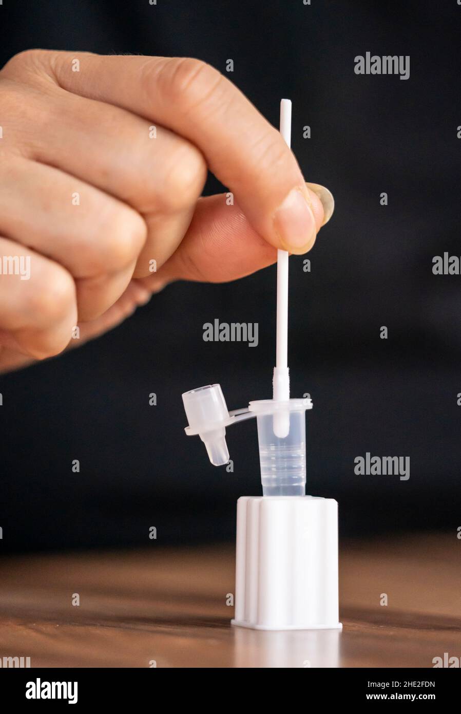 PICTURE POSED BY MODEL A person placing a swab from a Covid 19 lateral ...