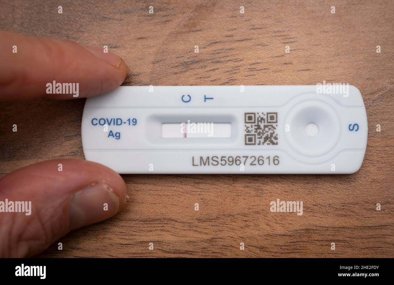 PICTURE POSED BY MODEL A person holding a Covid 19 lateral flow test ...