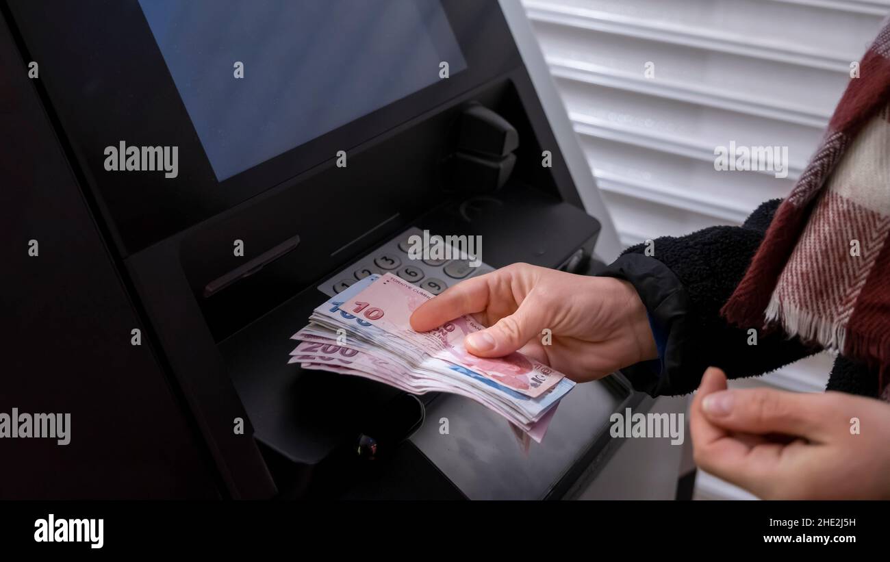 Withdrawing foreign currency hi-res stock photography and images - Alamy