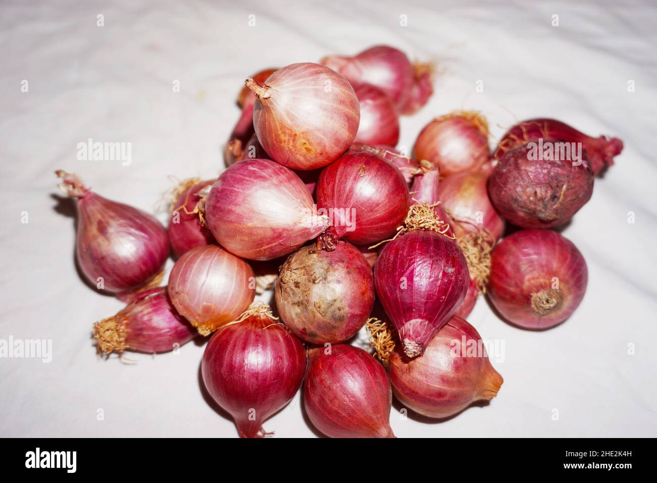 organic red onions closeup, isolated on white background Stock Photo ...