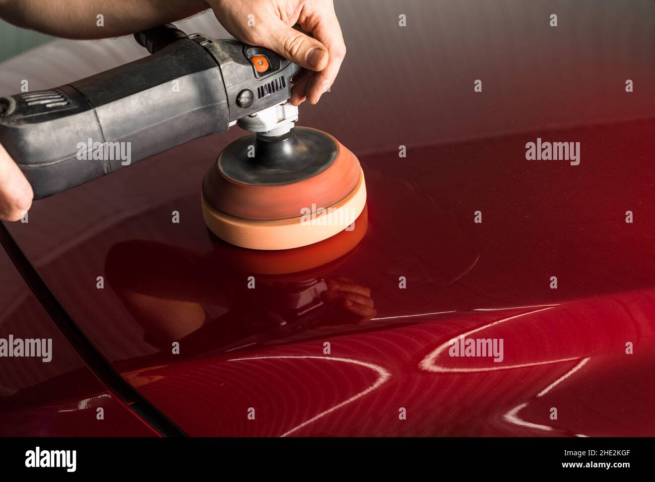 Polishing the body of a red car Stock Photo - Alamy
