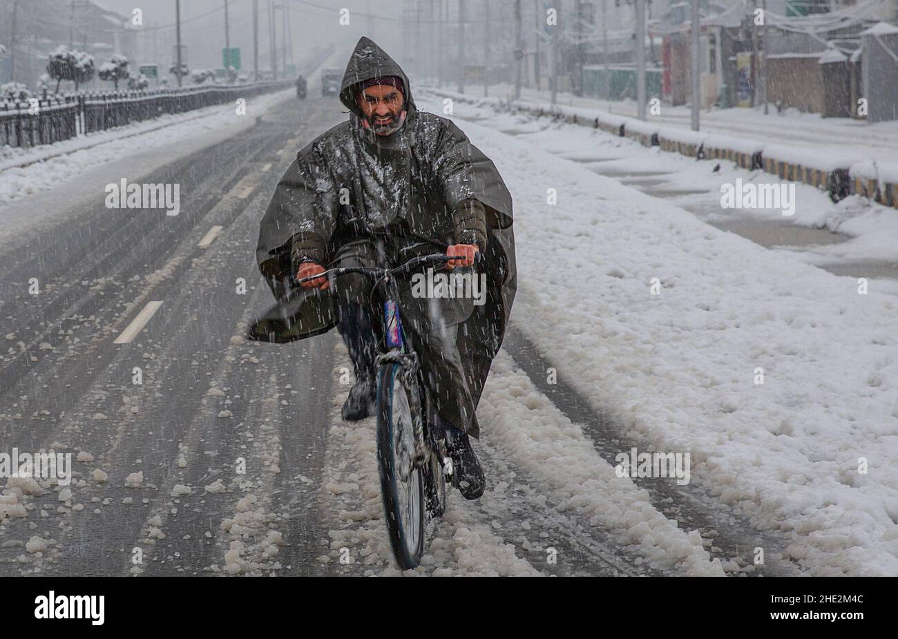 Srinagar, Indian-controlled Kashmir. 8th Jan, 2022. A man rides a ...