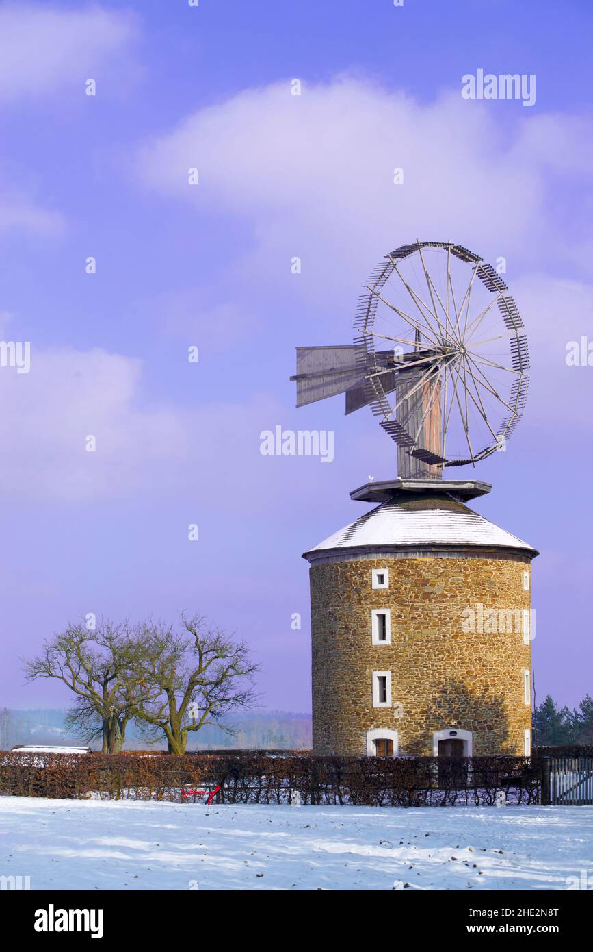 Old stone windmill in winter with blue cold sky Stock Photo - Alamy