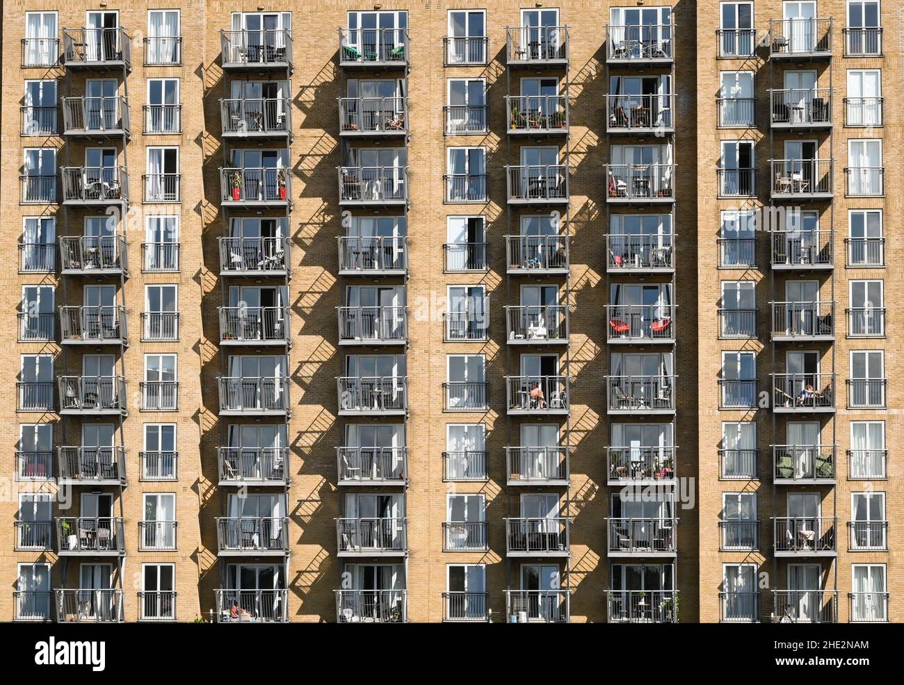 London, England - June 2021: Rows of balconies on an apartment block ...