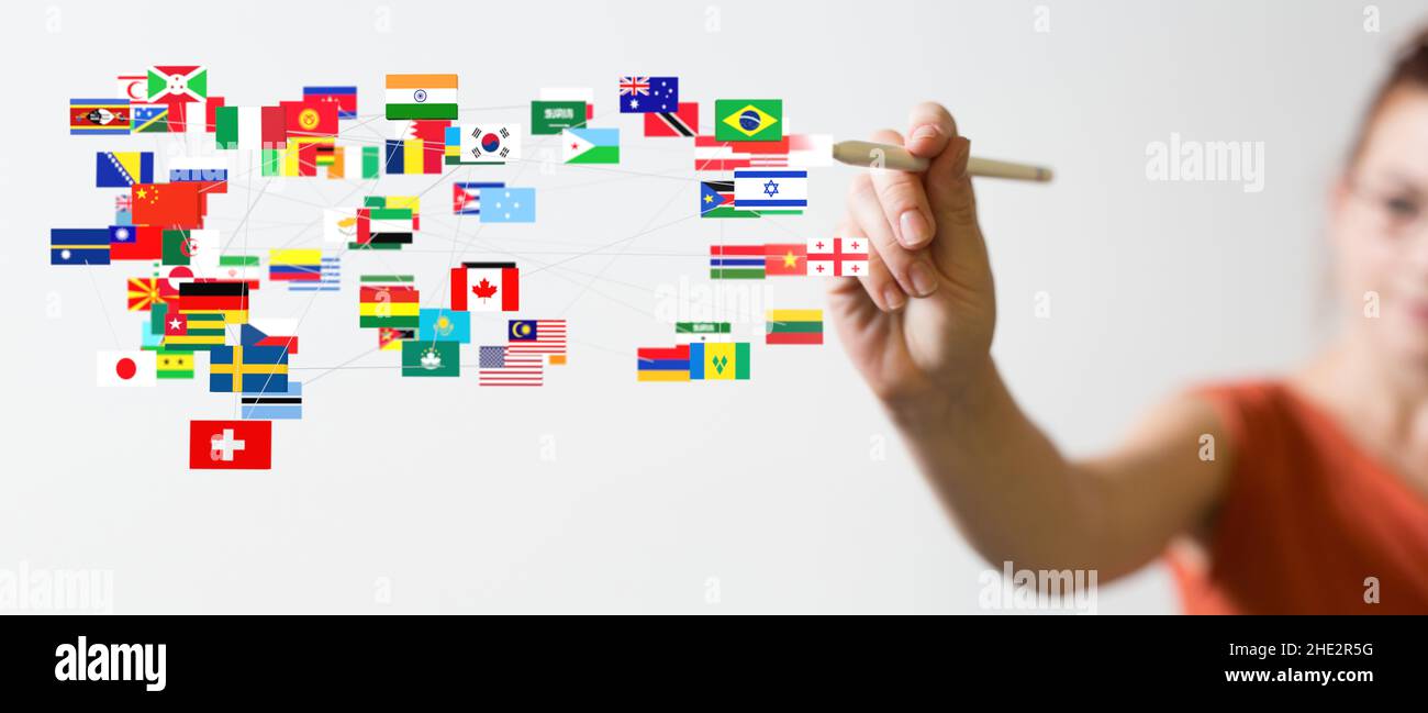 Female tapping on a floating network of international flags Stock Photo ...