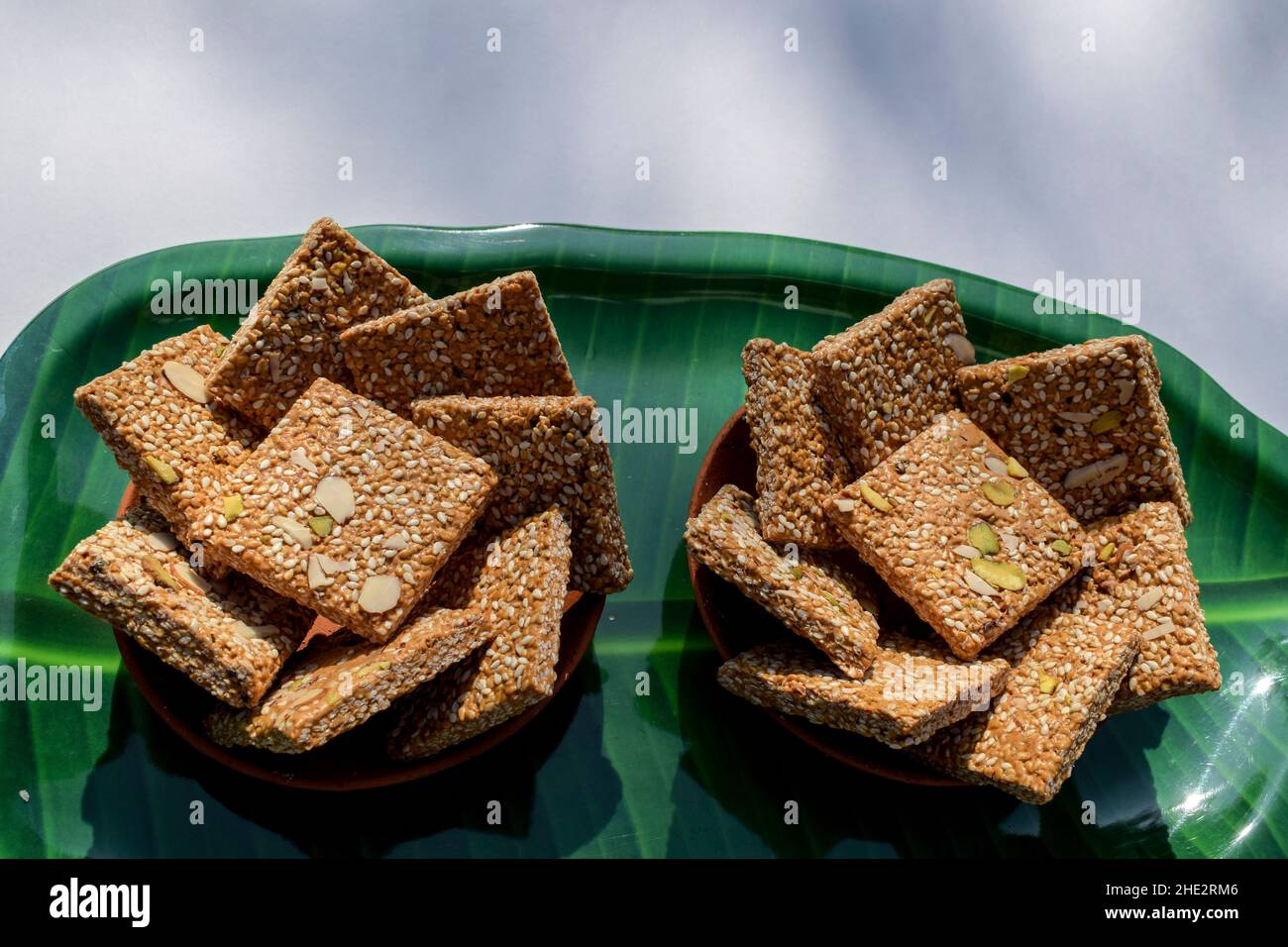 Badam Pista Gur Patti Gajak . It is made of jaggery and sesame slabs ...