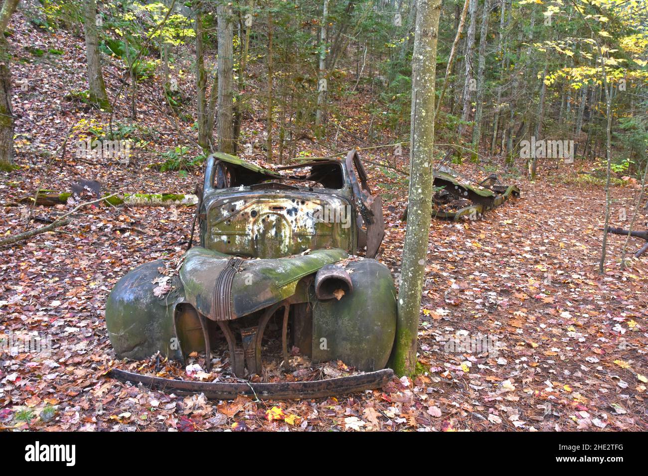Car skeleton from the past in the forest - Killarney, Ontario, Canada ...