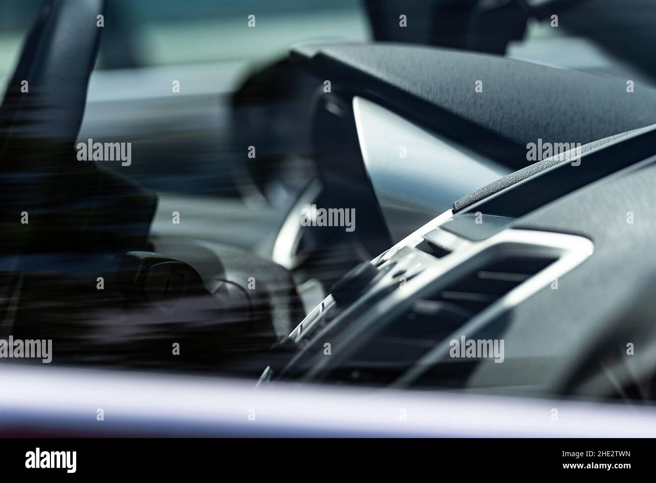 Hot car interior. Passenger car dashboard view through the side window ...