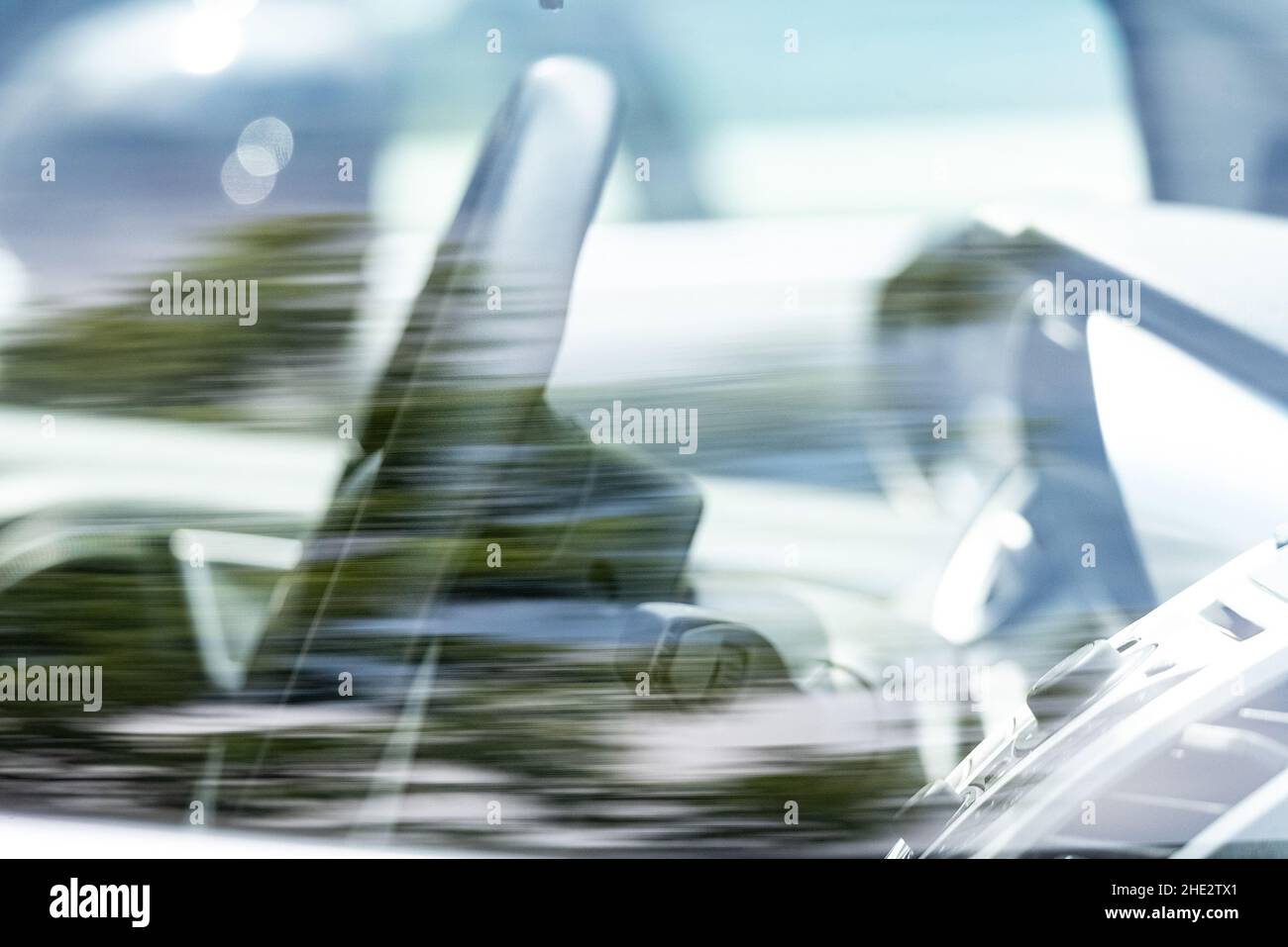 Hot car interior. Passenger car dashboard view through the side window ...