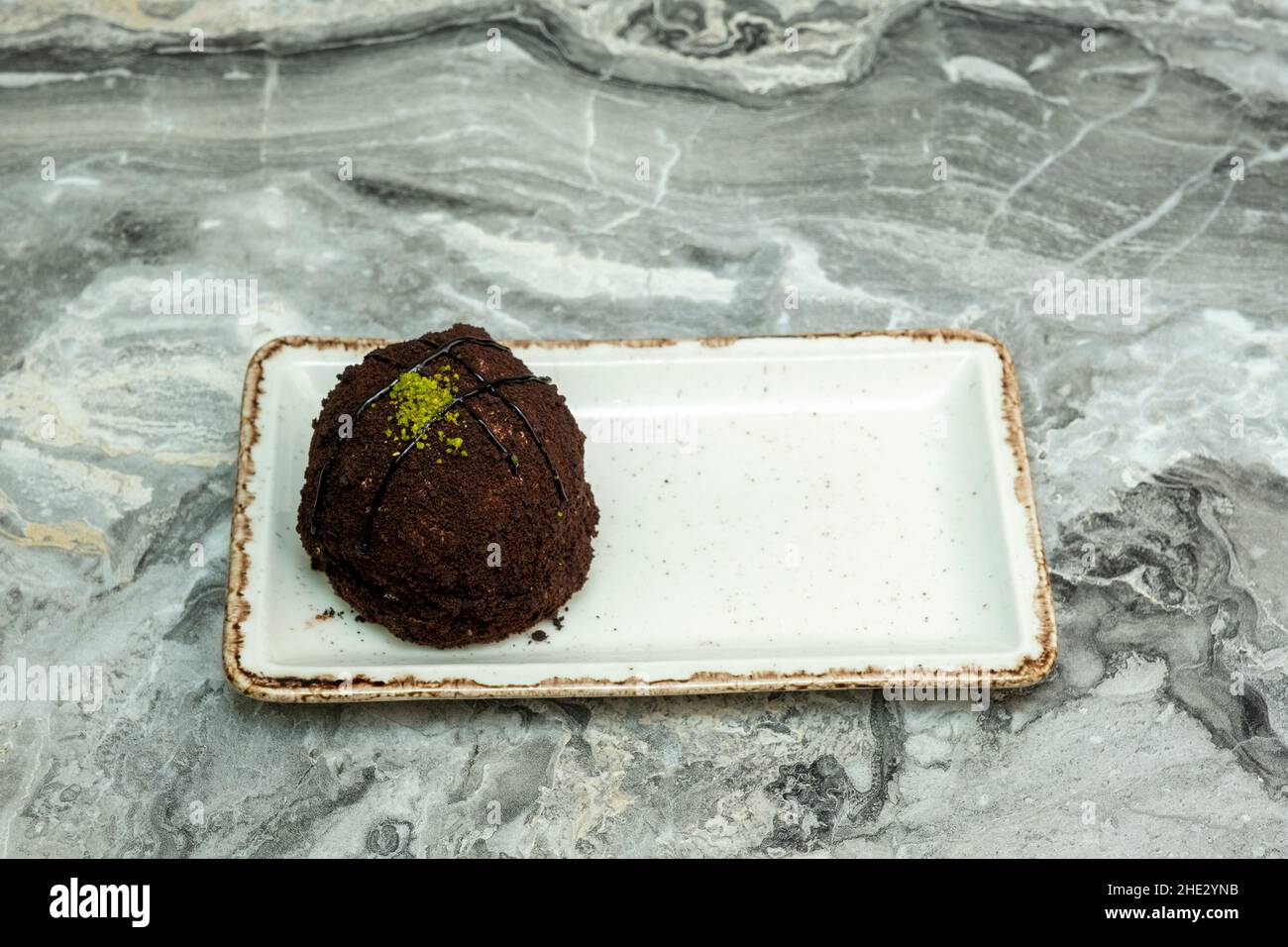 a slice of cake on a marble floor Stock Photo - Alamy
