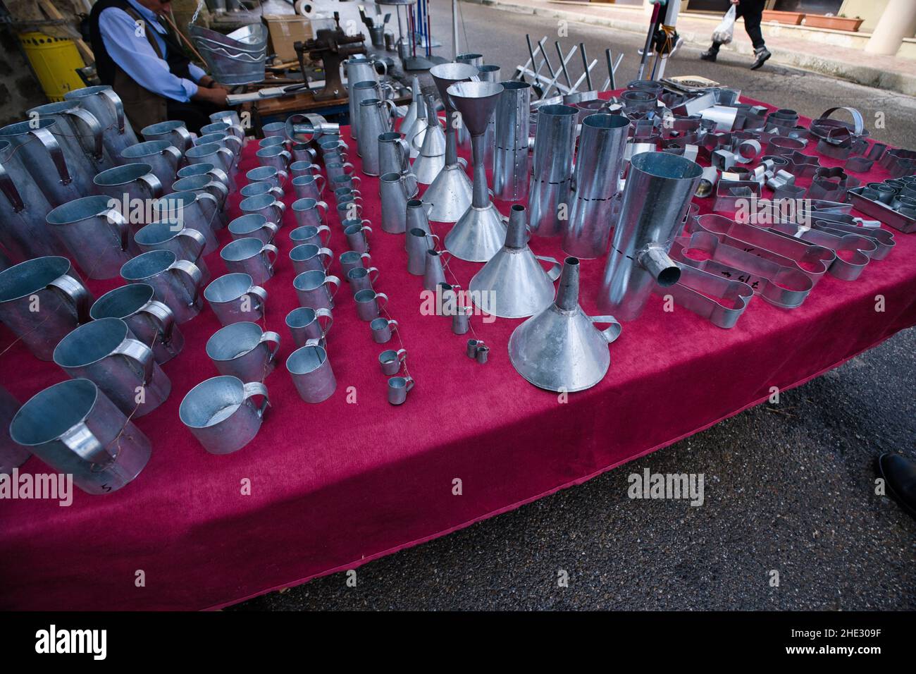 Collection of old style tin objects in a stall in a country fair Stock ...