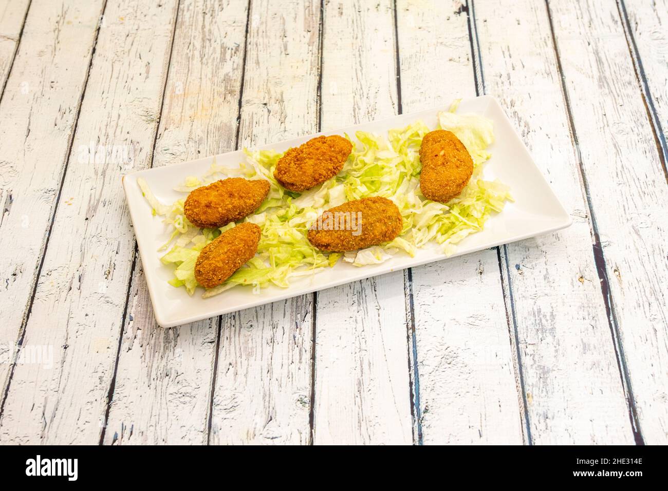 Whole Jalapeño peppers, stuffed with ranchero cheese in tomato sauce ...