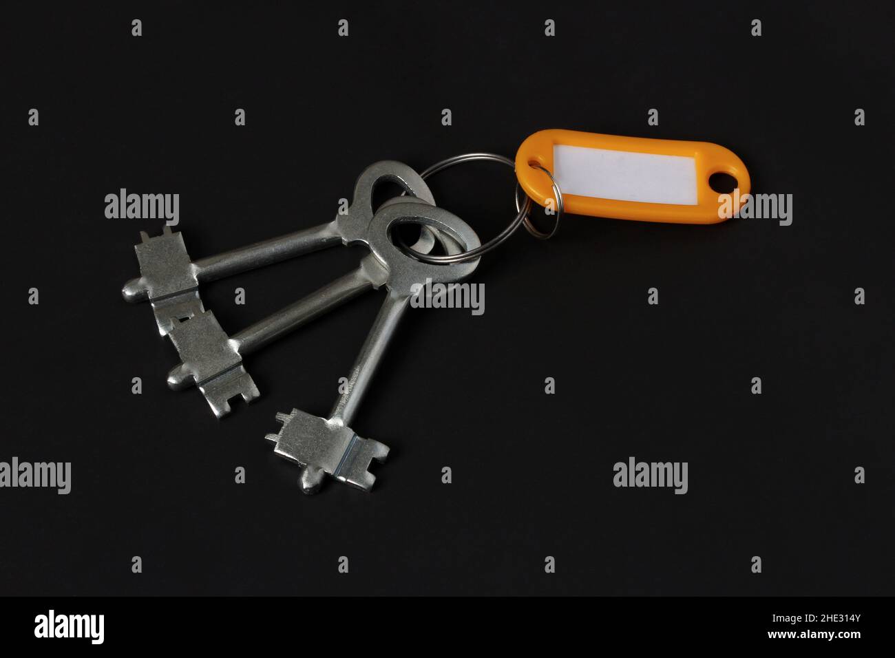 Set of apartment keys isolated on black Stock Photo - Alamy