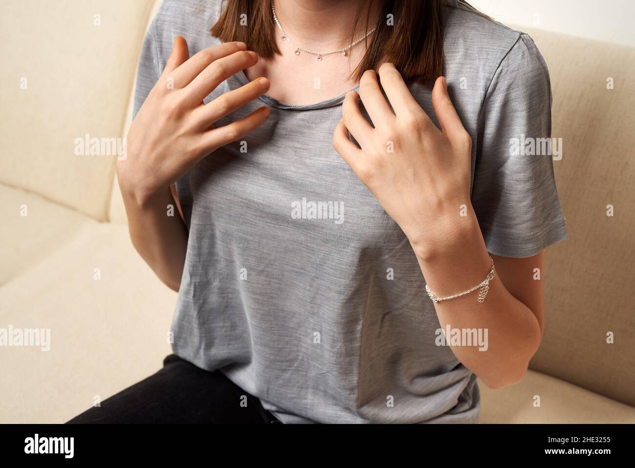Teenage girl practicing EFT or emotional freedom technique - tapping on ...
