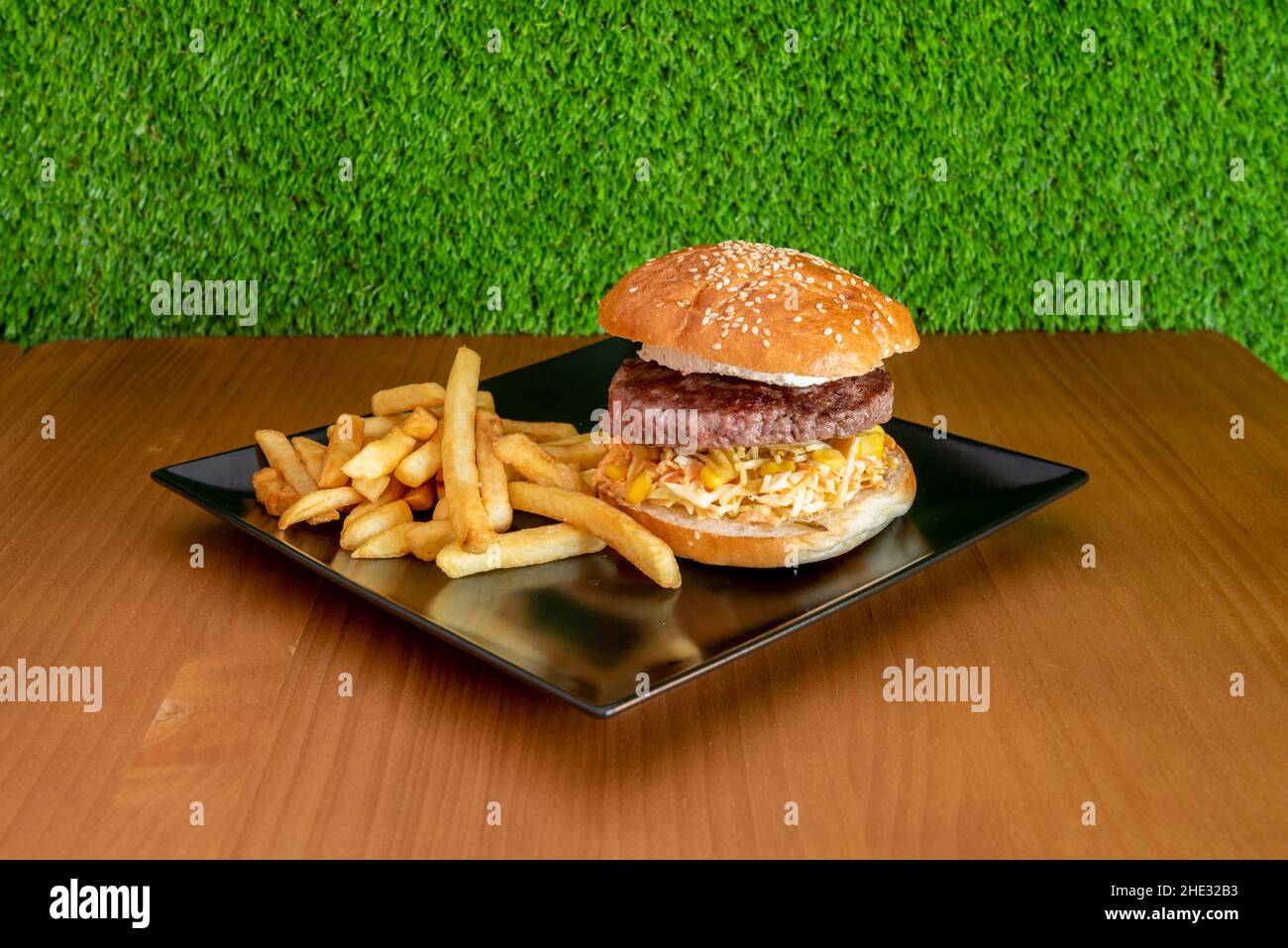 Beef burger with straw fries, goat cheese and caramelized onion ...