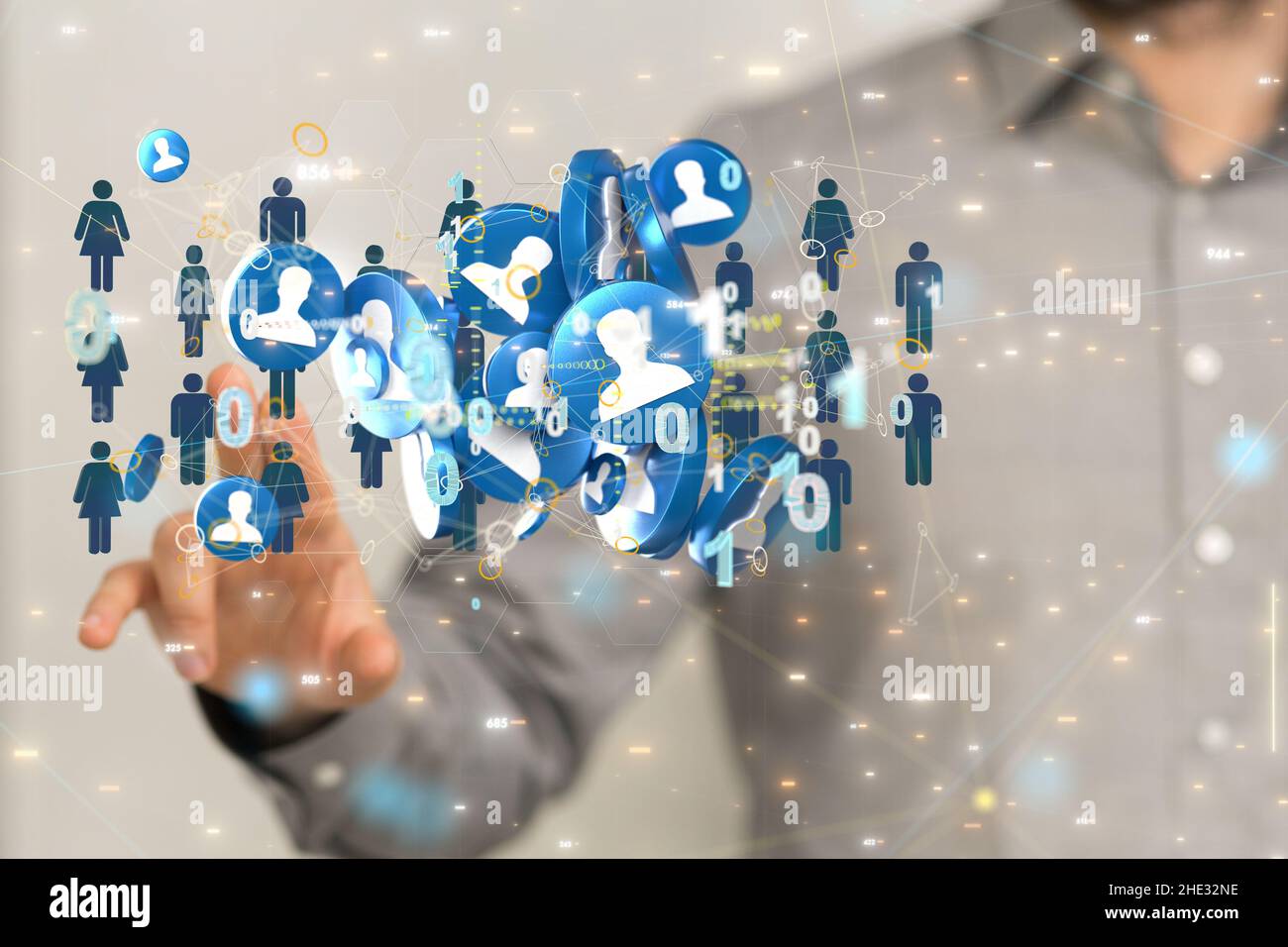 Businessman pointing at a floating render of blue profile icons Stock Photo - Alamy