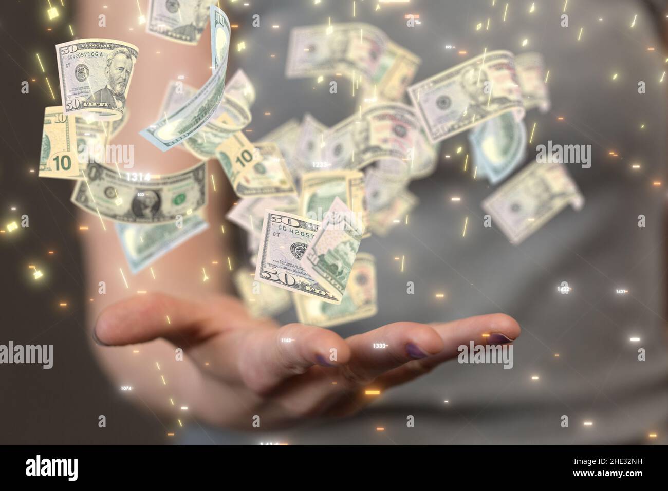 Businessman holding a floating render of dollar bills Stock Photo - Alamy