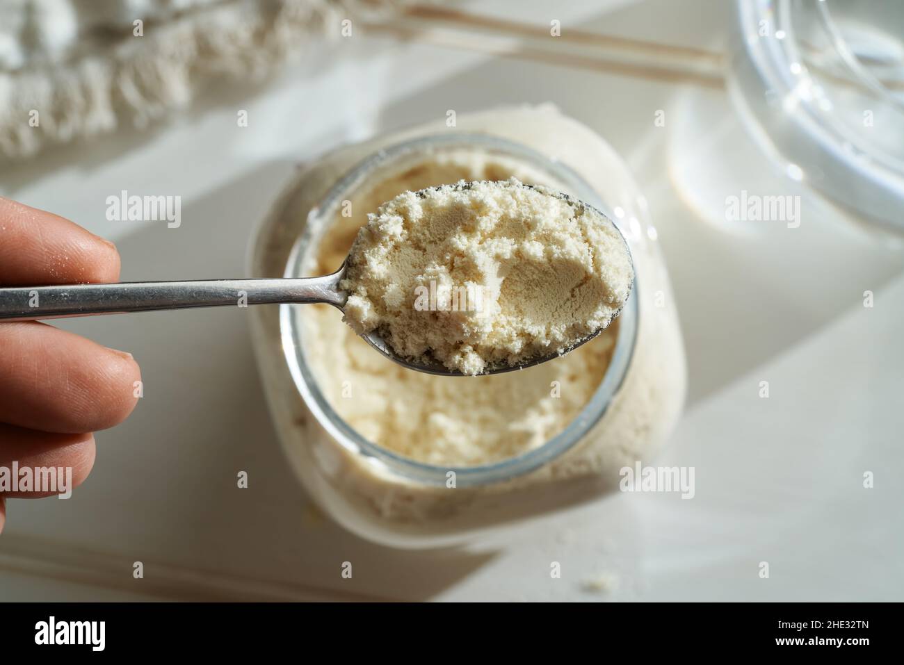 Whey protein powder on a spoon - preparation of a healthy drink Stock ...