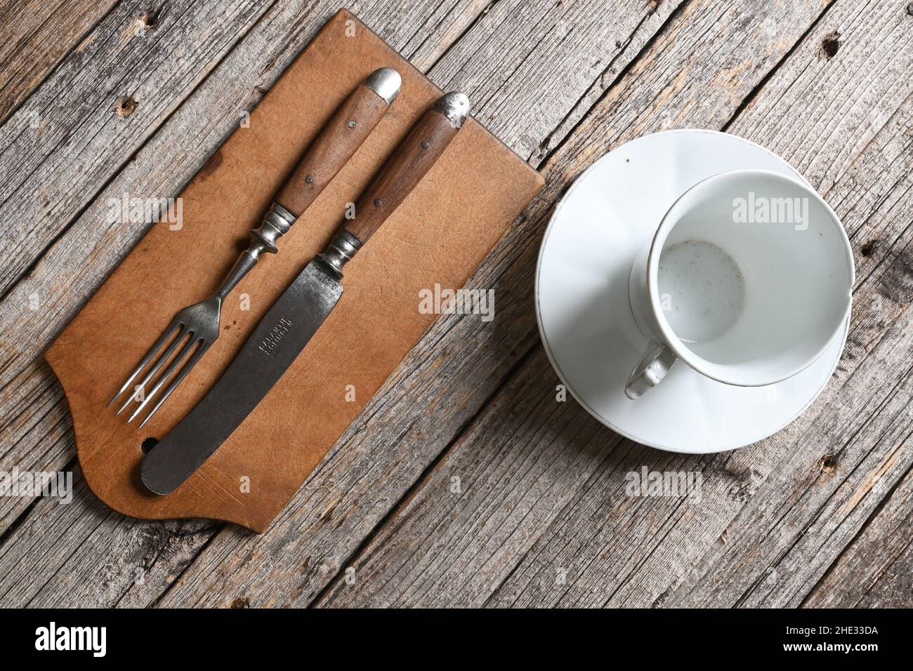 19th century working class dining set on rustic wood Stock Photo - Alamy