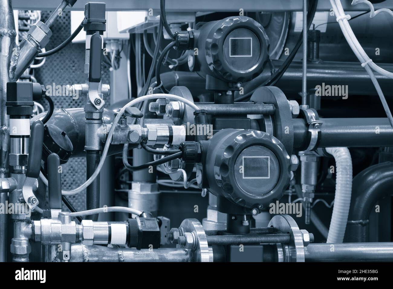 Close up of manometer, pipe, flow meter, water pumps and valves of ...