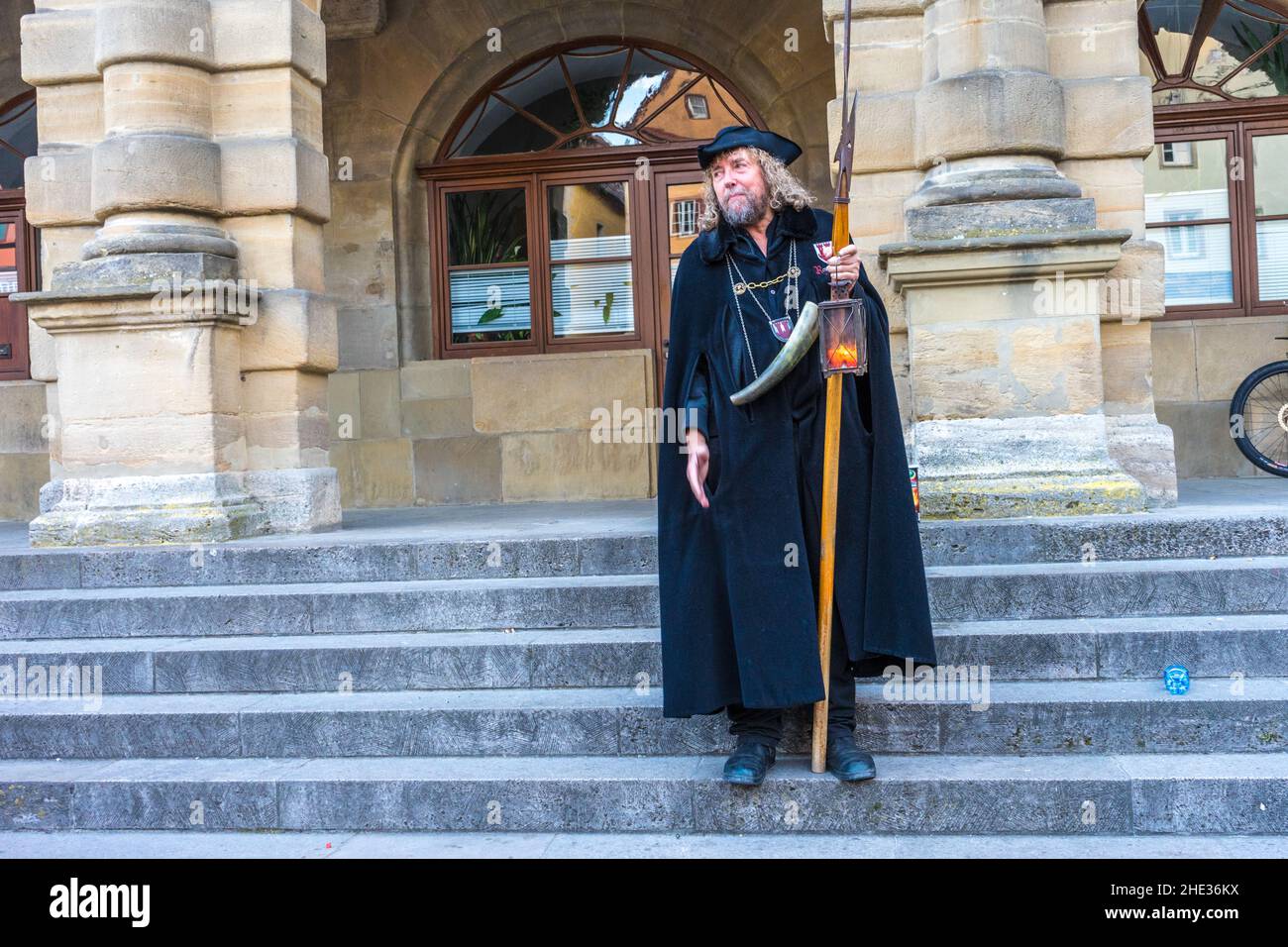 Vertical shot of The night watchman tour in Rothenburg, Germany Stock ...