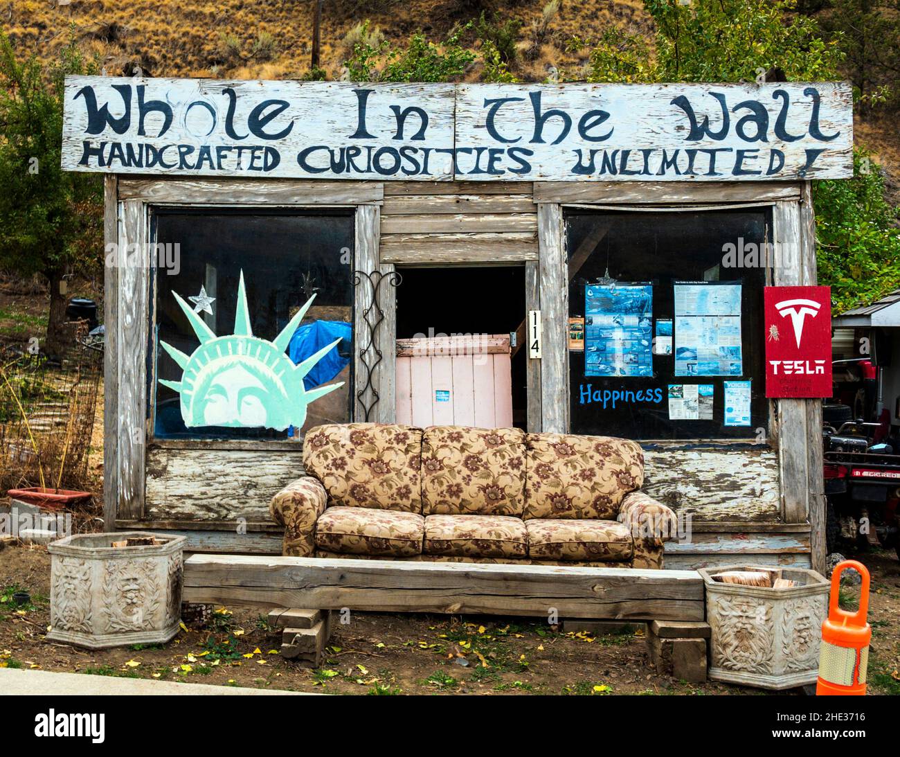 "Whole in the Wall"; weathered retail store in very small rural town of ...