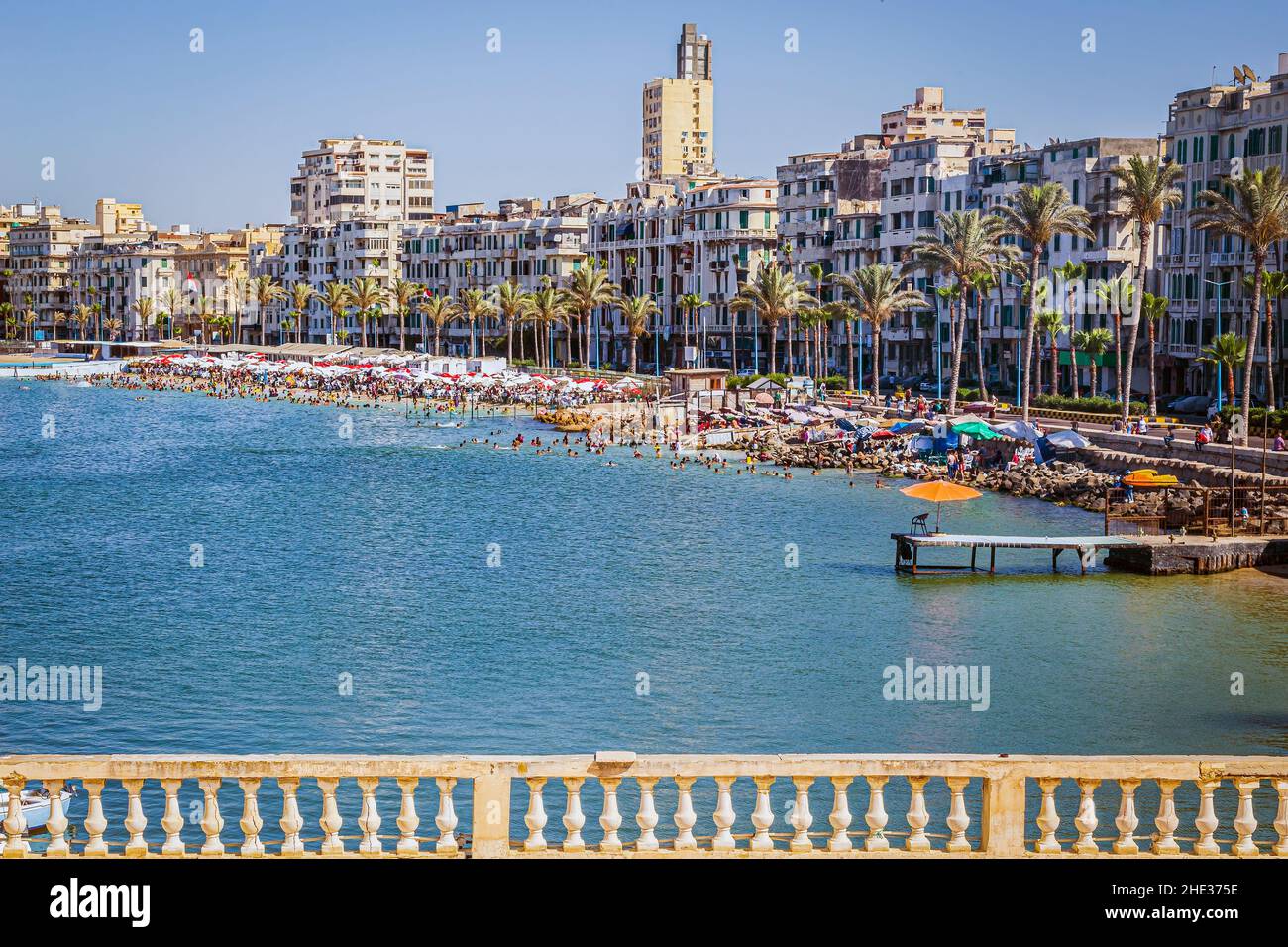 The city of Alexandria seen during daylight with people bathing in the ...