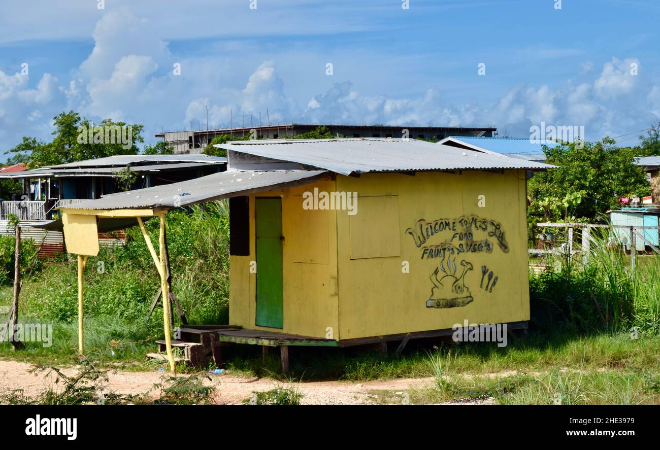 A little yellow wood shack serving as a shop providing the neighborhood ...