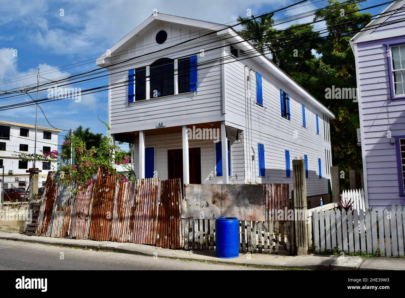 A restored wooden house with blue shutters in Belize City, Belize Stock ...