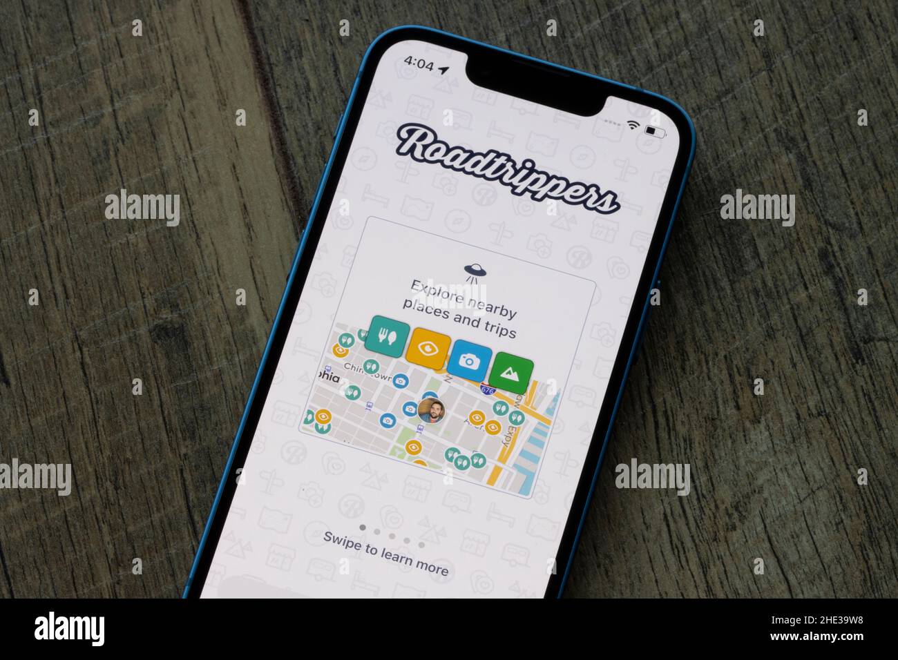 Roadtrippers Trip Planner mobile app landing page is seen on an iPhone ...